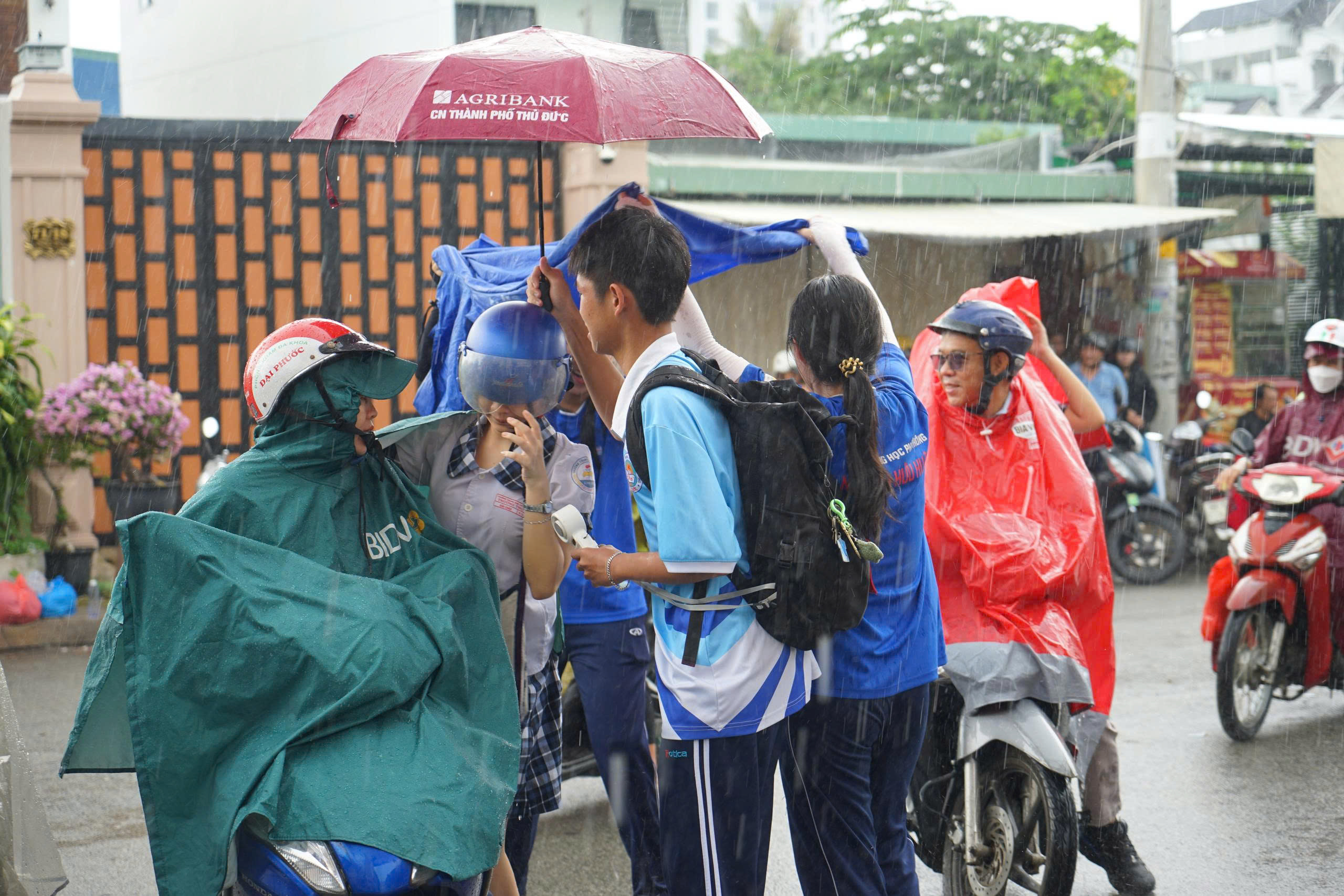 Despite the sudden rain, students braved the downpour to support the ...